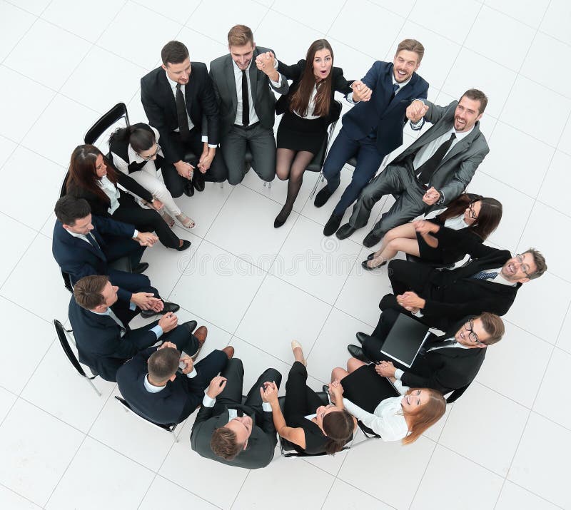 Concept of Team Building .large Successful Business Team Sitting in a ... Concept of Team Building .large Successful Business Team Sitting in a ...