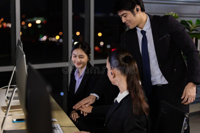 Concept of Teamwork. Business Team Joined Hands and Working Overtime at ...