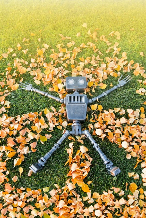 Happy Humanoid Robot Lies on the Autumn Grass Stock Photo - Image of ...