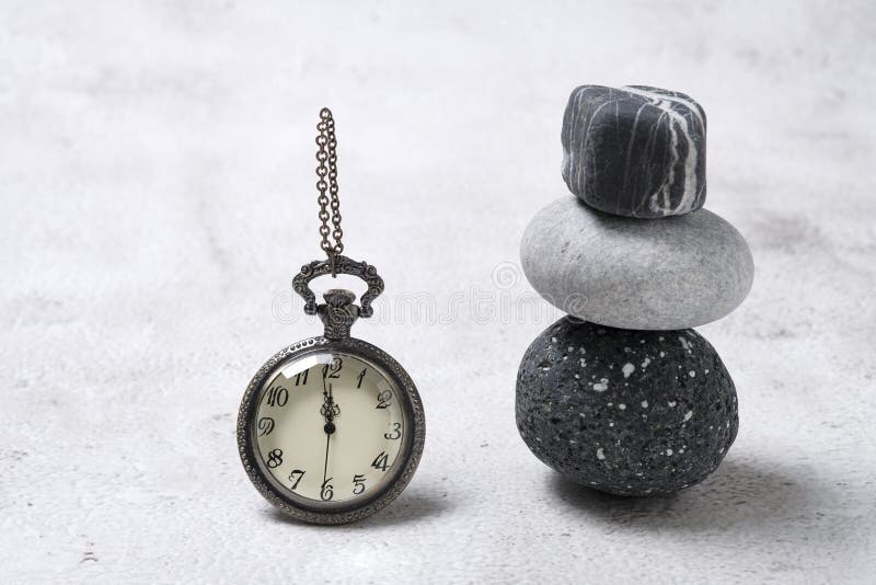 The Concept of Time and Stones. Vintage Clock with Zen Stones Stock ...