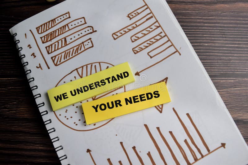 On the Table are Business Charts, Office Supplies and a Notepad with ...