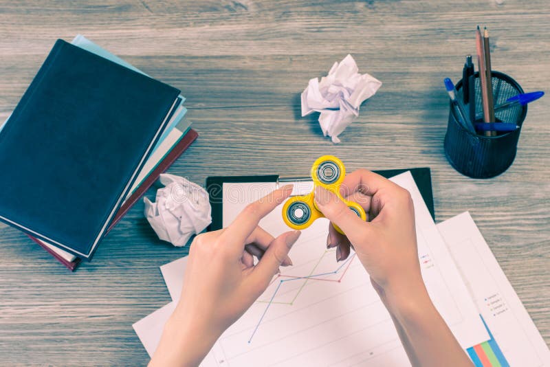 Concept of Using Fidget Spinner at Work while Having a Break. Hands ...