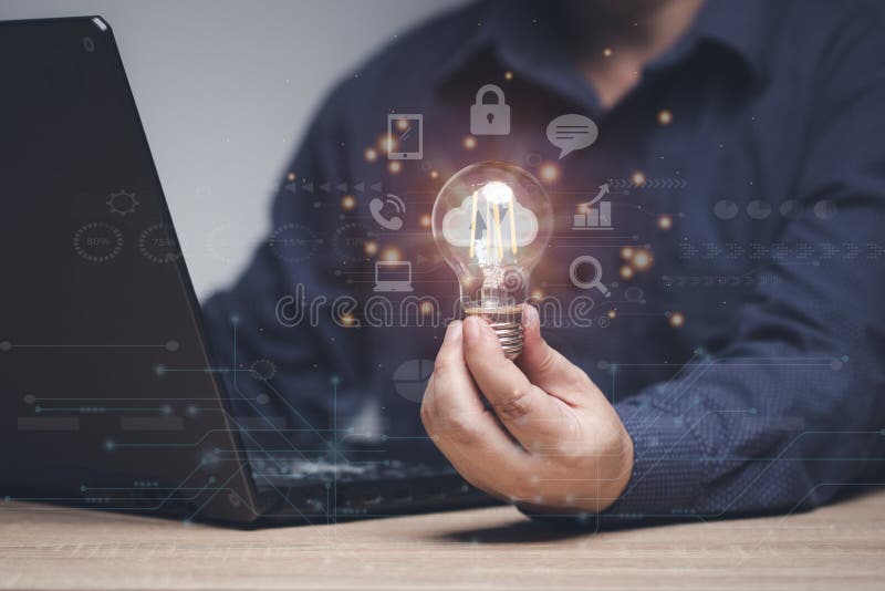 The Concept of Using Technology in Work. Man Holding a Light Bulb that ...