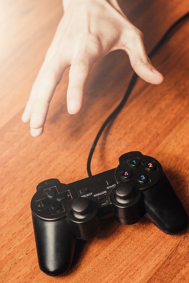 Hand Reaching for the Joystick. Concept of Video Games Addiction Stock ...