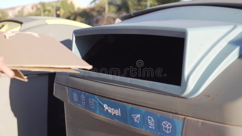 Concept, Waste Sorting. a Woman Throws Empty Cardboard Boxes into a ...