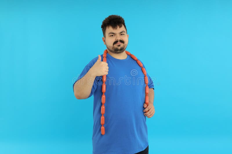Concept of Weight Problems, Young Fat Man on Blue Background Stock ...