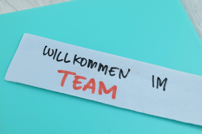 Concept of Willkommen Im Team Write on Sticky Notes Isolated on Wooden ...