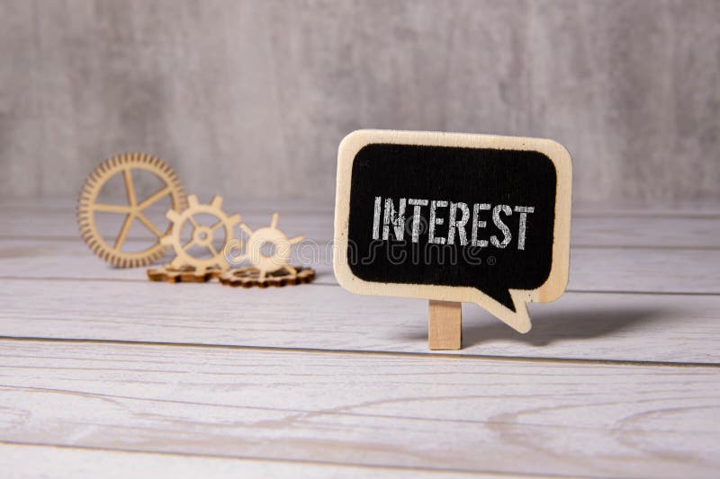 Concept of the Wooden Cubes with the Word Interest on Wooden Background ...