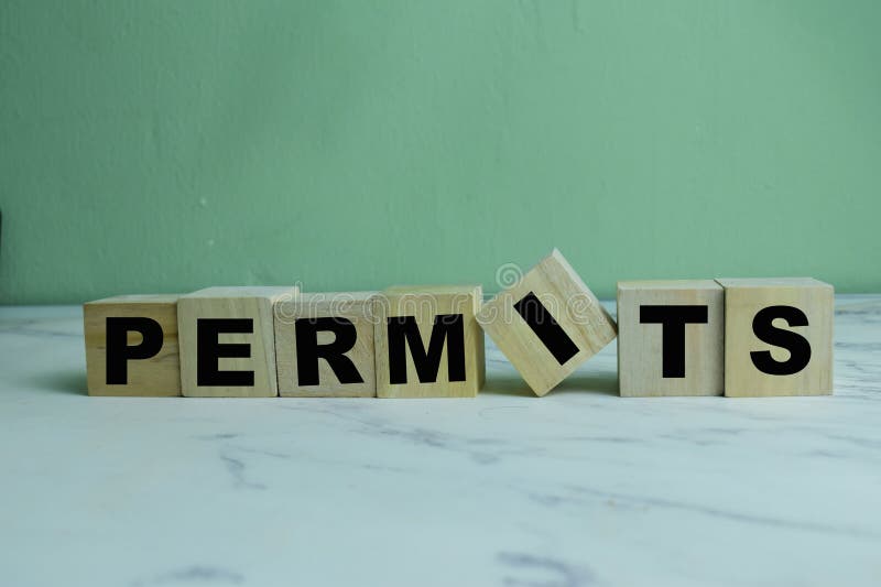 Concept of Permits Write on Sticky Notes Isolated on Wooden Table Stock ...