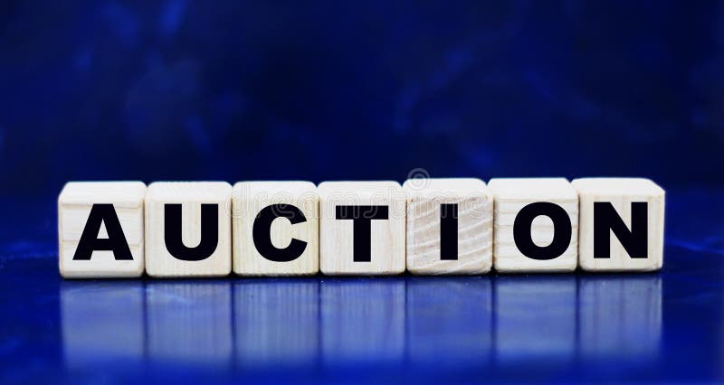 Concept Word Auction on Wooden Cubes on a Blue Background Stock Image ...