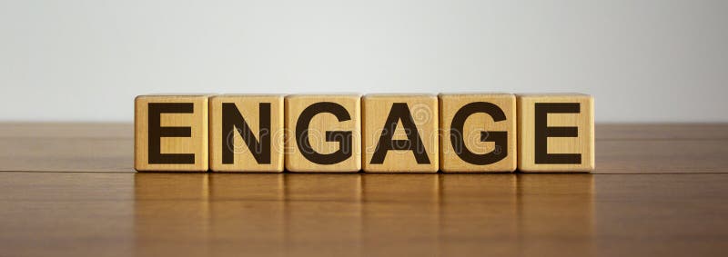 Word Engage Written in Wooden Blocks in Notebook on White Wooden Stock ...