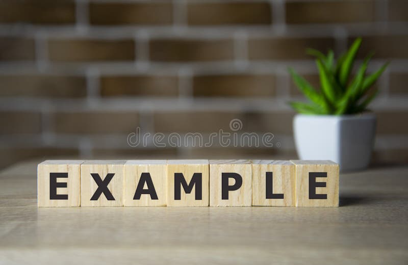 Concept Word Example on Wooden Cubes on a Beautiful Background. Wooden ...