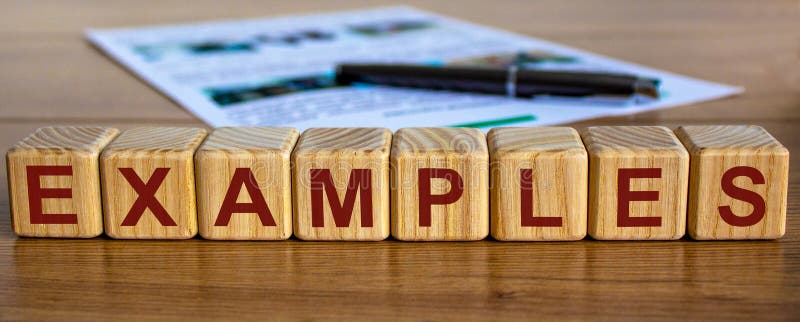 Concept Word `examples` on Cubes on a Beautiful Wooden Table, Pen and ...