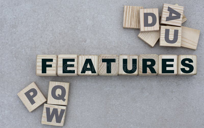 Features Written in Red with a Newspaper Article Blurred Stock Image ...