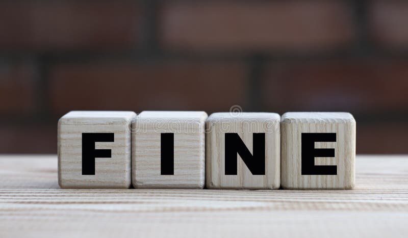 The Word FINE on Wooden Cubes Against the Background of the Judge S ...