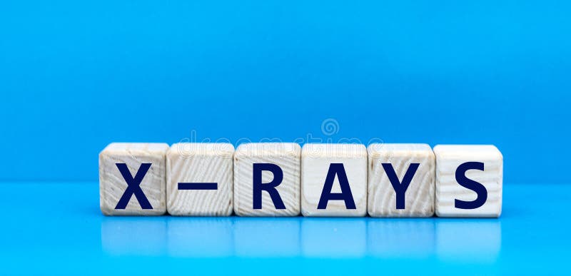 Concept Word X-RAYS on Cubes on a Blue Background Stock Photo - Image ...