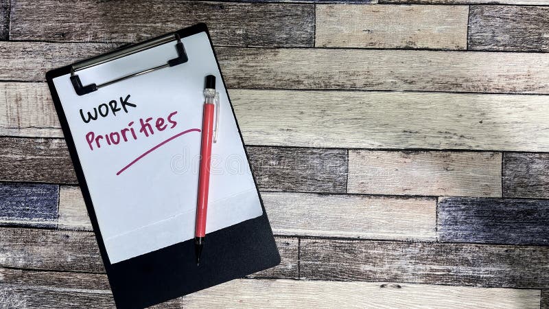 Concept of Work Priorities Write on Paperwork Isolated on Wooden Table ...