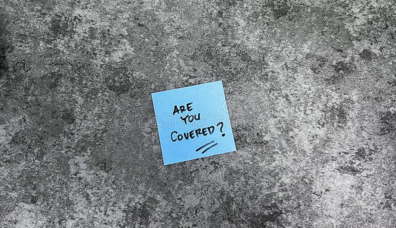 Concept of are You Covered? Write on Sticky Notes Isolated on Wooden ...
