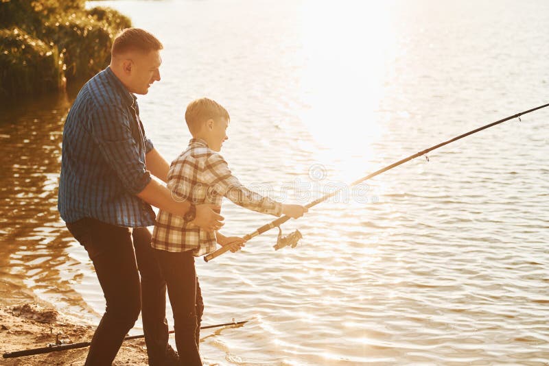 Conception of Hobbies. Father and Son on Fishing Together Outdoors at ...