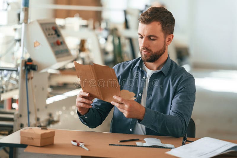 Conception of Labor. Handsome Man is Working at the Factory of Creating ...