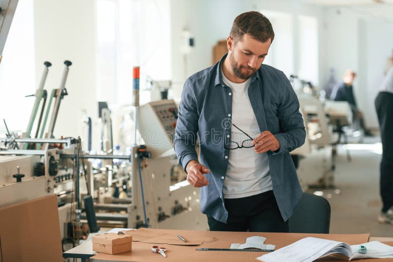 Conception of Labor. Handsome Man is Working at the Factory of Creating ...
