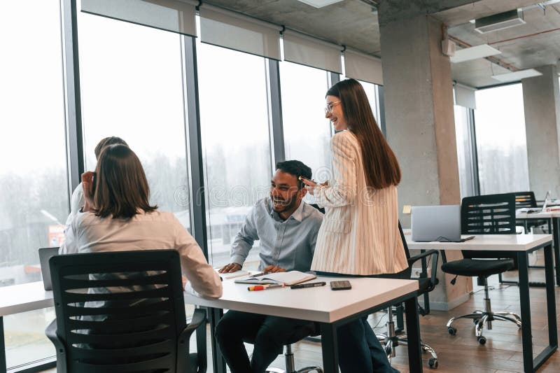 Conception of Teamwork. Four People are in the Office Together Stock ...