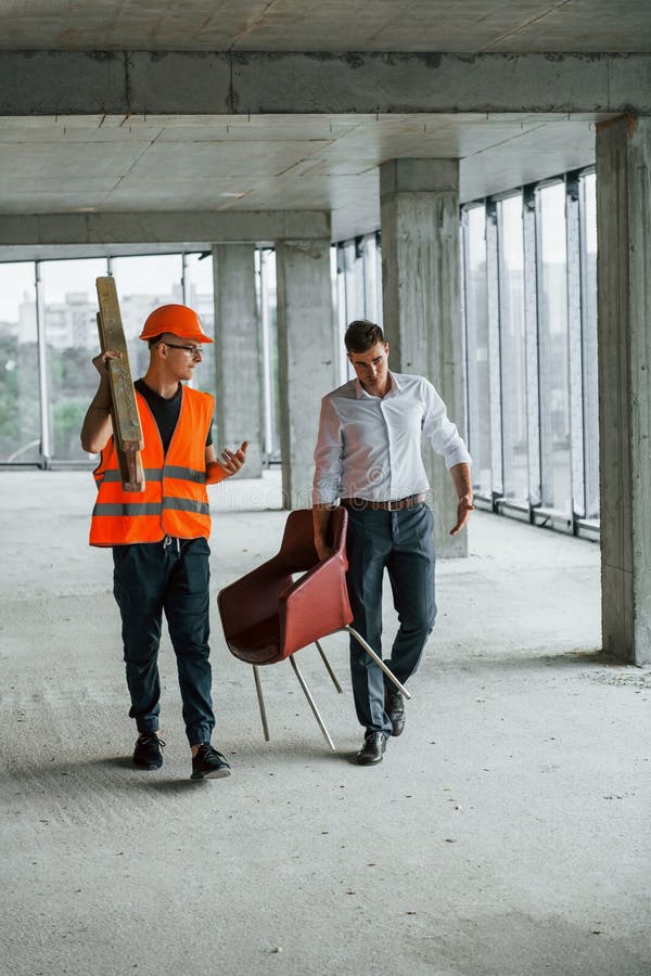 Conception of Teamwork. Man in Suit and Handyman in Orange Protective ...