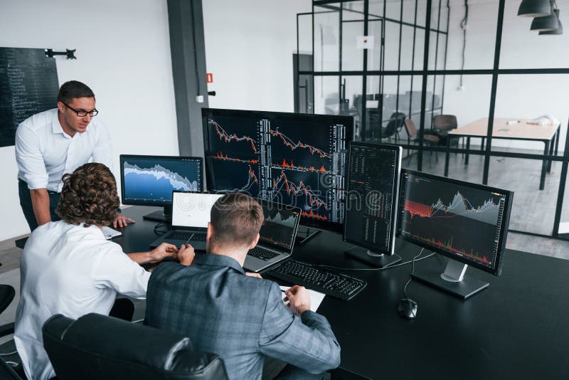 Conception of Teamwork. Team of Stockbrokers Works in Modern Office ...