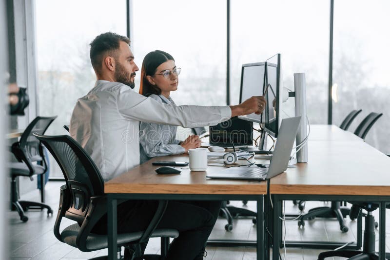 Conception of Teamwork. Two Employees are in the Office Together Stock ...