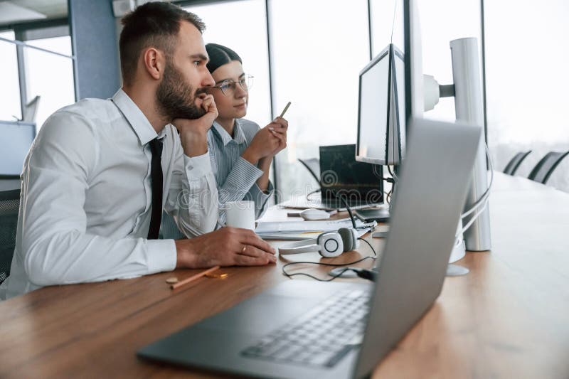 Conception of Teamwork. Two Employees are in the Office Together Stock ...