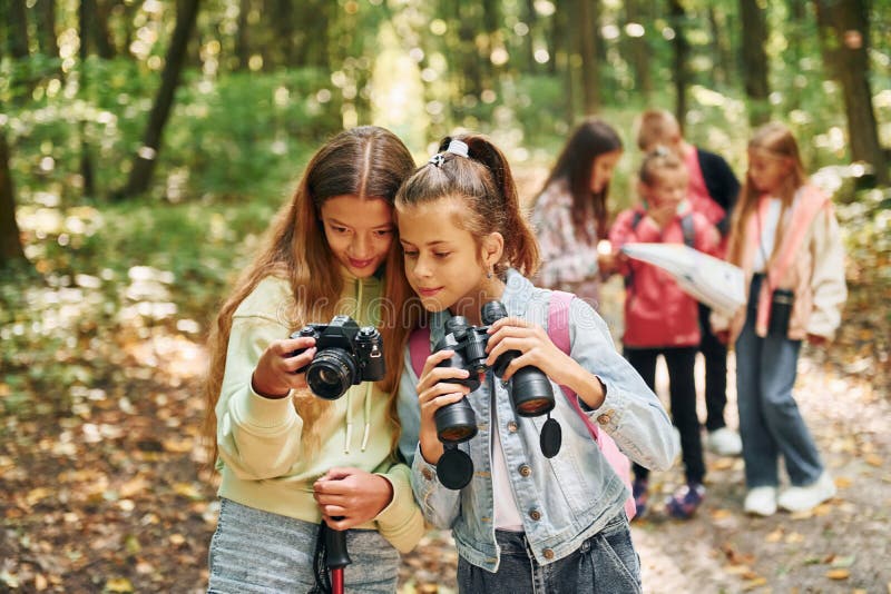 Conception of Tourism. Kids in Green Forest at Summer Daytime Together ...