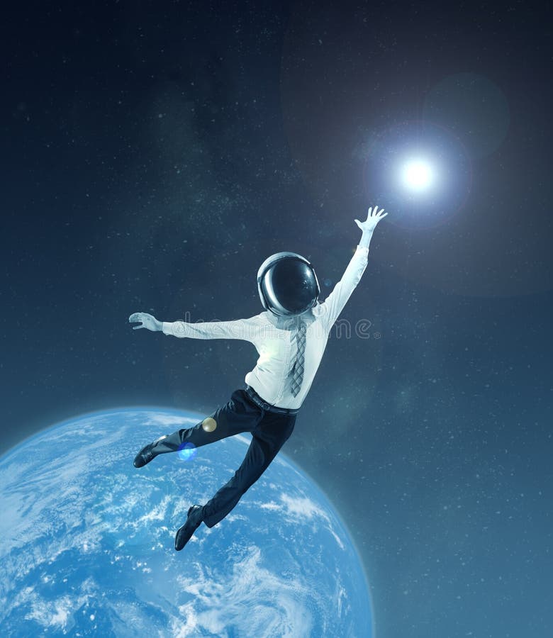 Conceptual Creative Artwork with Businessman in Helmet Flying at Outer ...