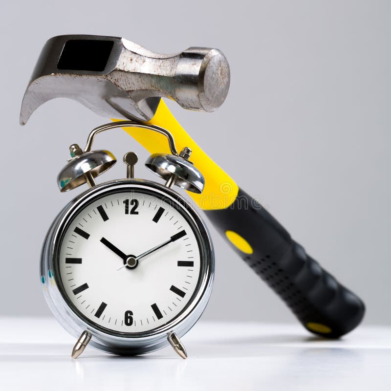 Conceptual Hammer Tool on a Round Alarm Clock Stock Image - Image of ...