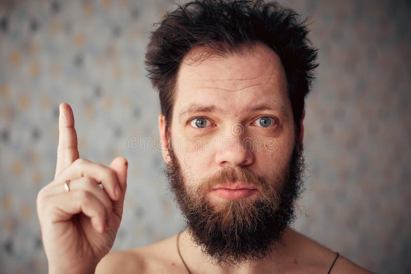 The Conceptual Idea of a Caucasian Man with a Beard Shows Index Finger ...
