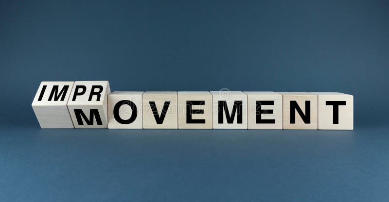 A Conceptual Image Featuring Wooden Blocks Spelling Out IMPROVEMENT and ...