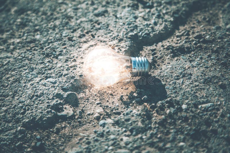 Conceptual Image of Light Bulb on Asphalt Ground Stock Image - Image of ...