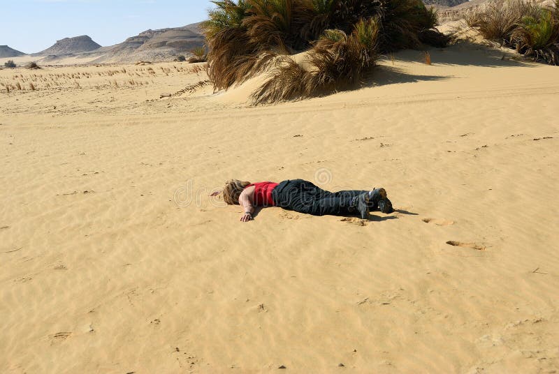 Human body in the desert stock image. Image of lying - 128420249