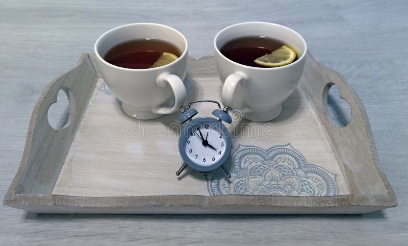 Conceptually - Tea Time - with Two Cups of Tea and a Clock Stock Image ...
