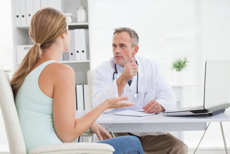 Concerned Doctor Talking To His Patient Stock Image - Image of adult ...