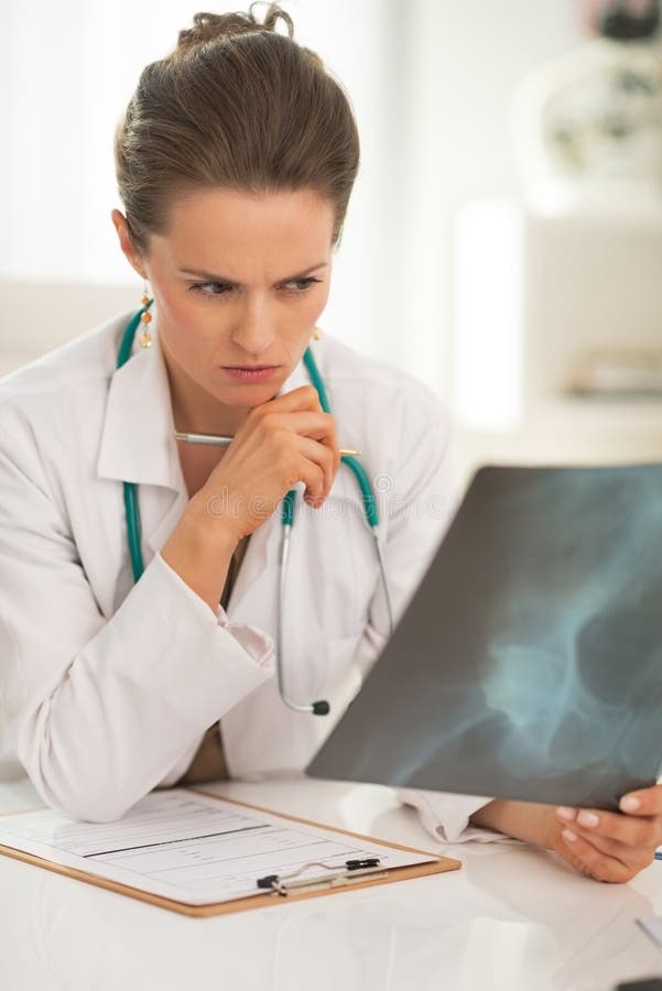 Concerned Doctor Woman Looking Fluorography Stock Photos - Free ...