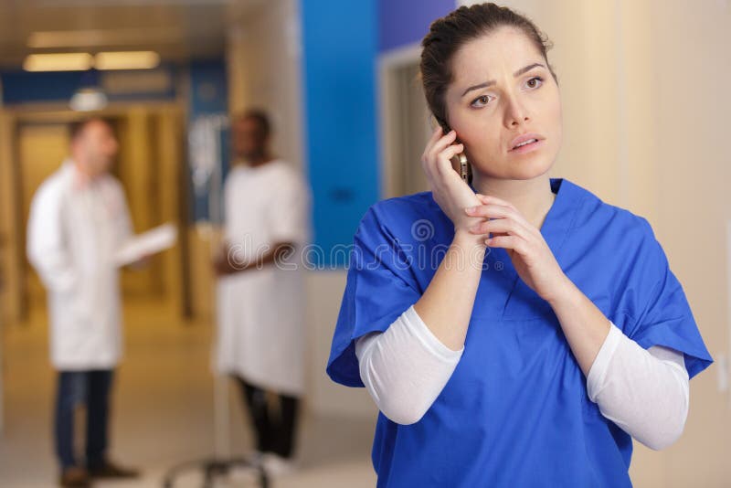 Concerned Female Doctor in Uniform Talking on Phone Stock Image - Image ...