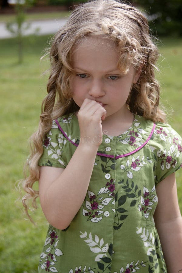Concerned Little Girl stock photo. Image of worried, upset - 18128376