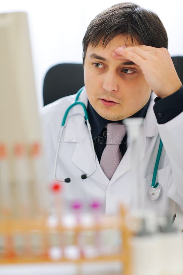 Concerned Medical Doctor Working on Computer Stock Photo - Image of ...