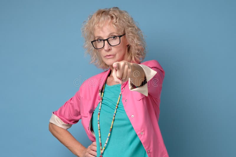 Concerned Strict Mature Woman Pointing Index Finger On Camera Choosing