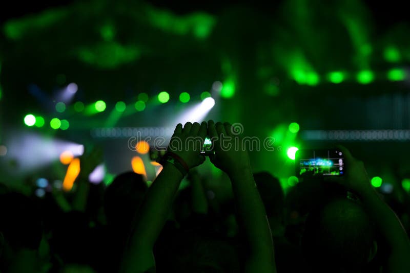 Concert Crowd in Front of Bright Stage Lights Stock Photo - Image of ...