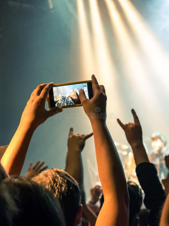 People Clapping at Night Concert, Partying and Raising Hands for the ...