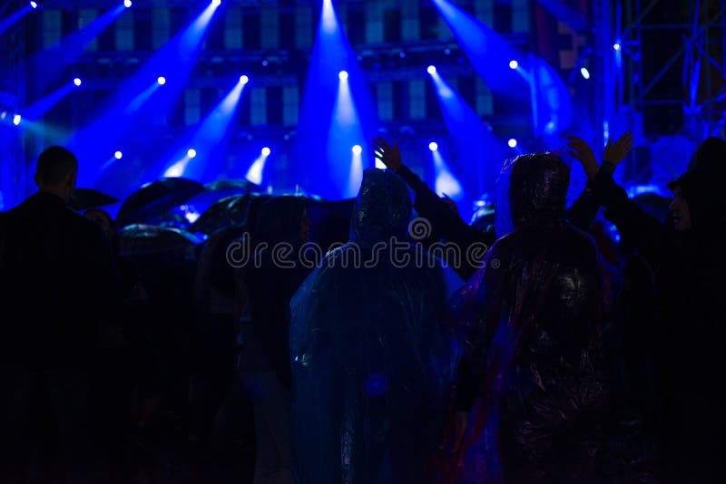 Concert crowd in the rain stock photo. Image of caucasian - 110281000