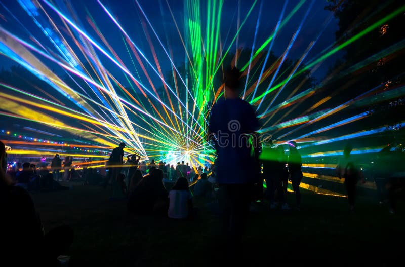 Concert Light Show - Laser Lights and Silhouettes of People Stock Photo ...
