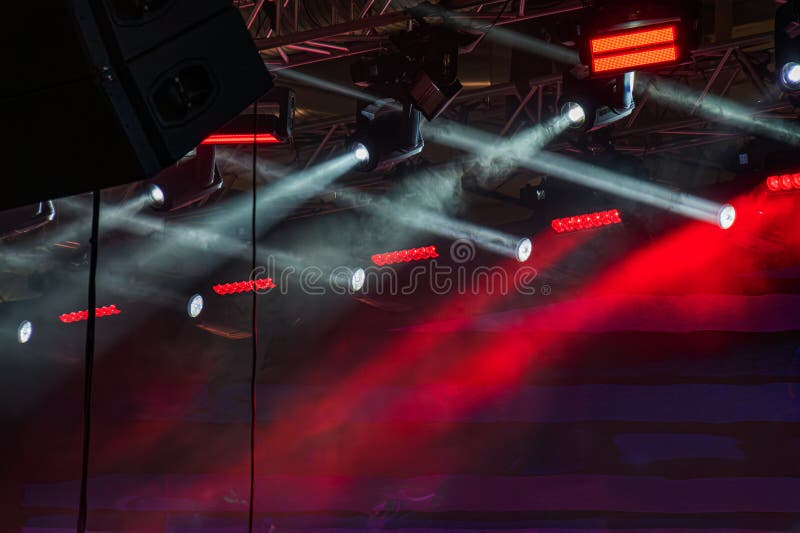 Concert Stage with Dramatic Red Lighting, Elevated Platform, Smoke, and ...