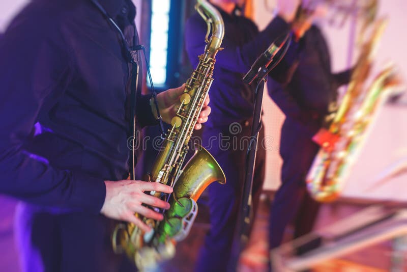 Concert View of a Saxophonist, Saxophone Player with Vocalist and ... Concert View of a Saxophonist, Saxophone Player with Vocalist and ...